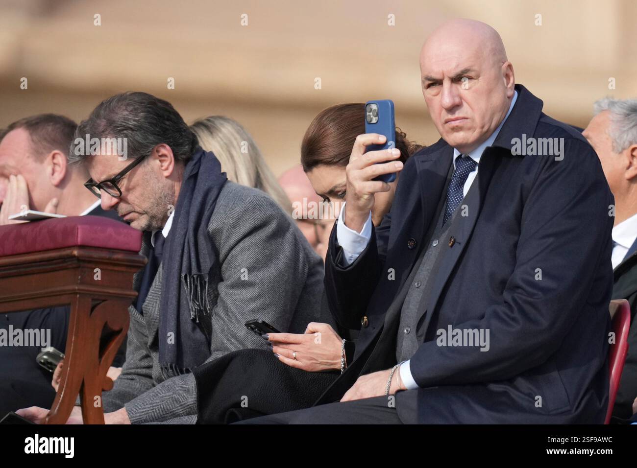 Italy's Minister of Defence Guido Crosetto, right , is flanked by his ...
