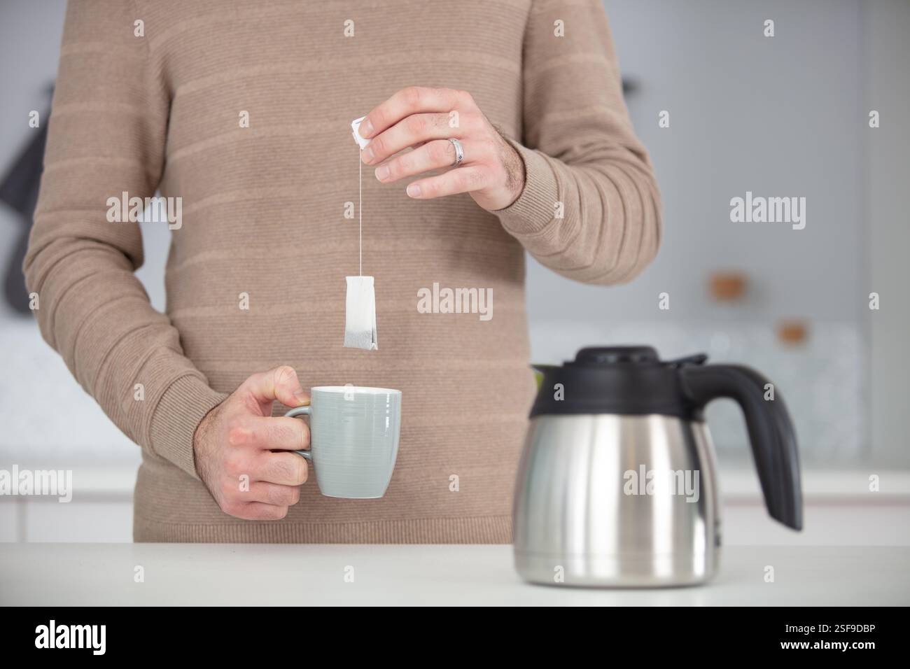 Closeup man preparing tea hi-res stock photography and images - Alamy