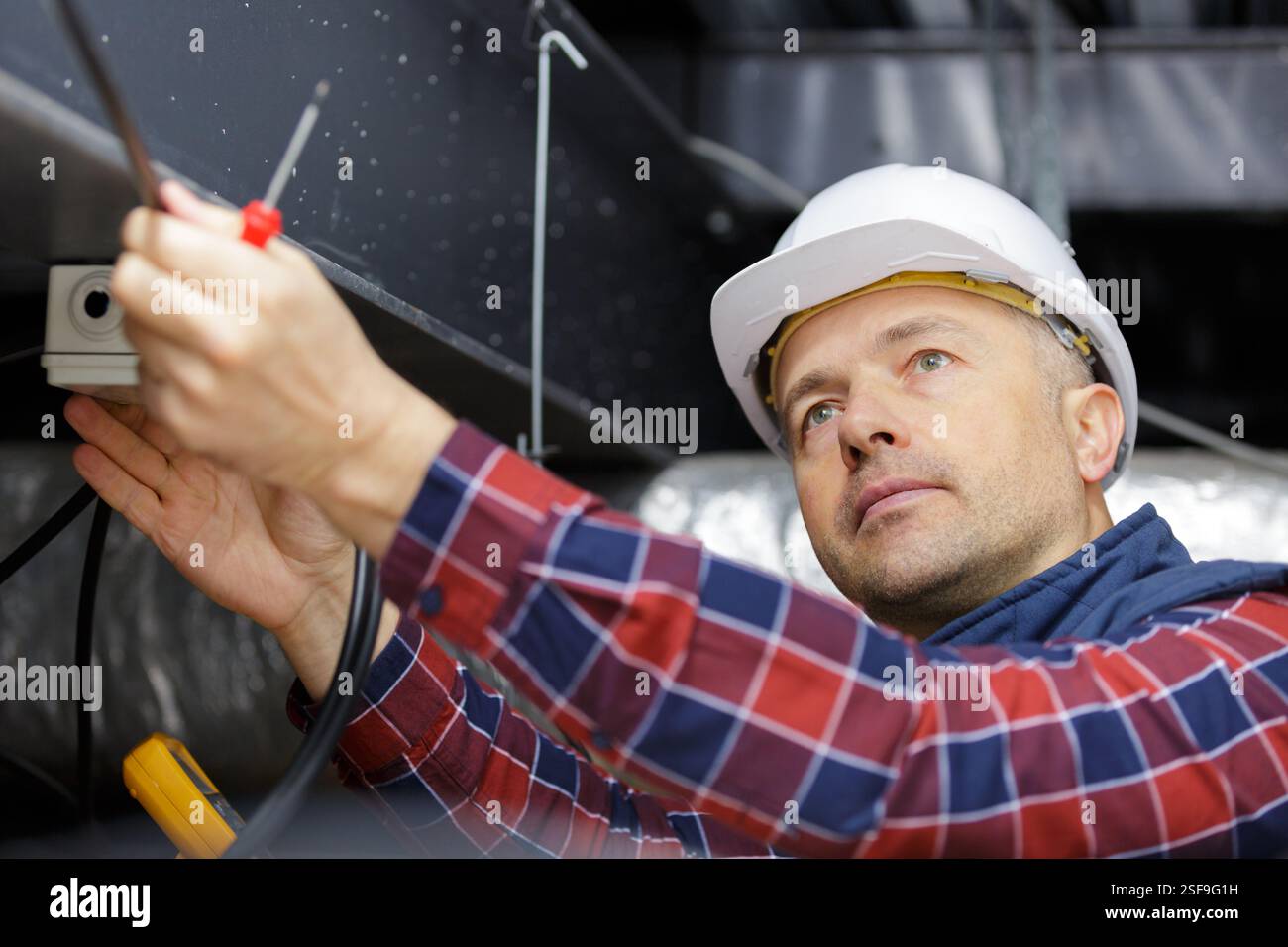 electrician engineer tests electrical installations Stock Photo - Alamy