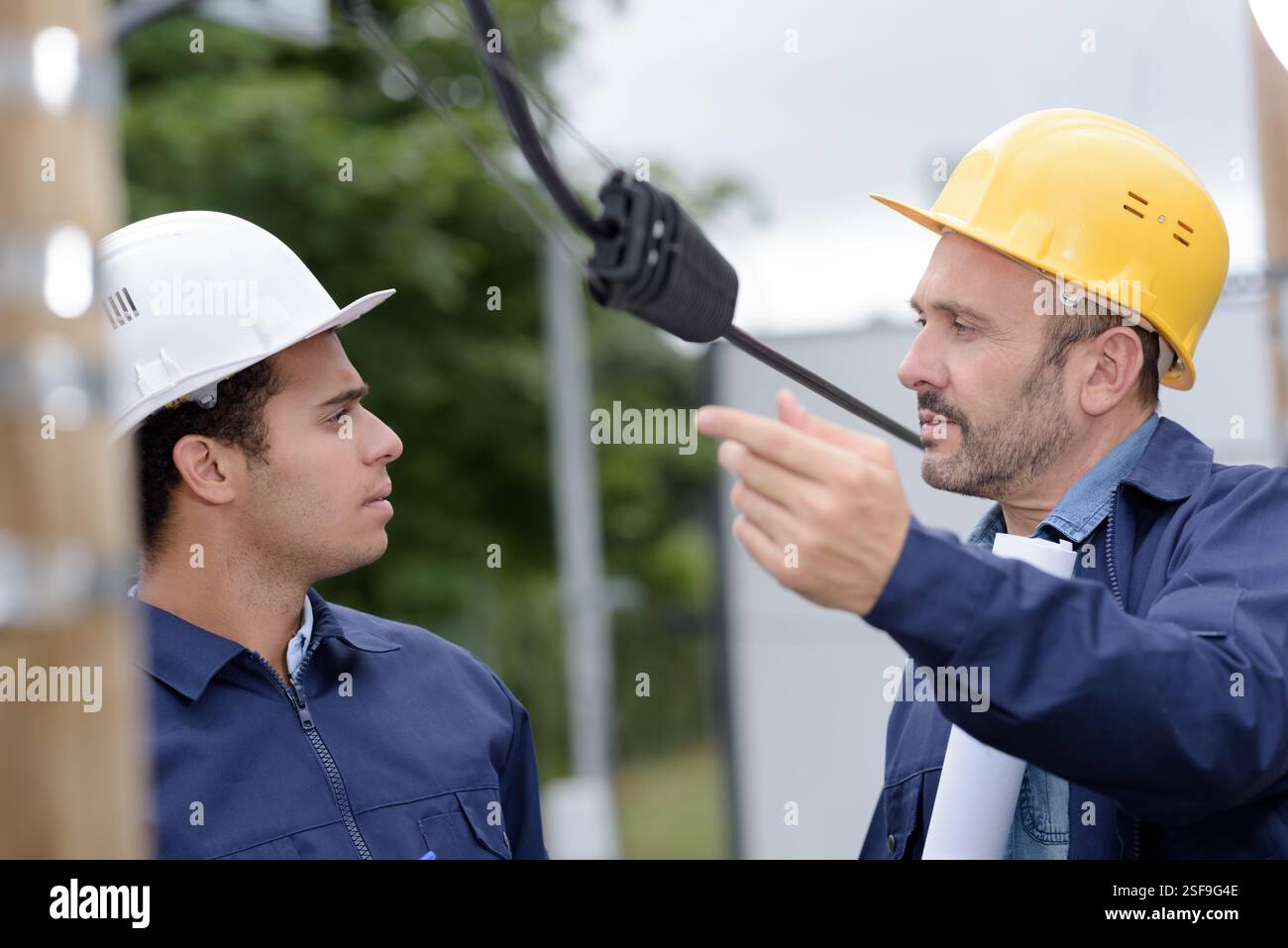technician men fixing or repairing broken power line Stock Photo - Alamy