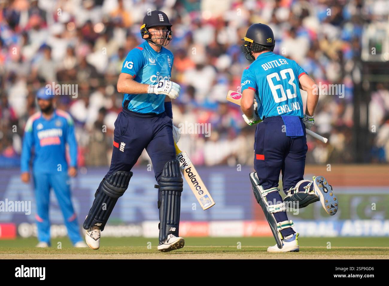 England's captain Jos Buttler, right, and Joe Root run between the ...