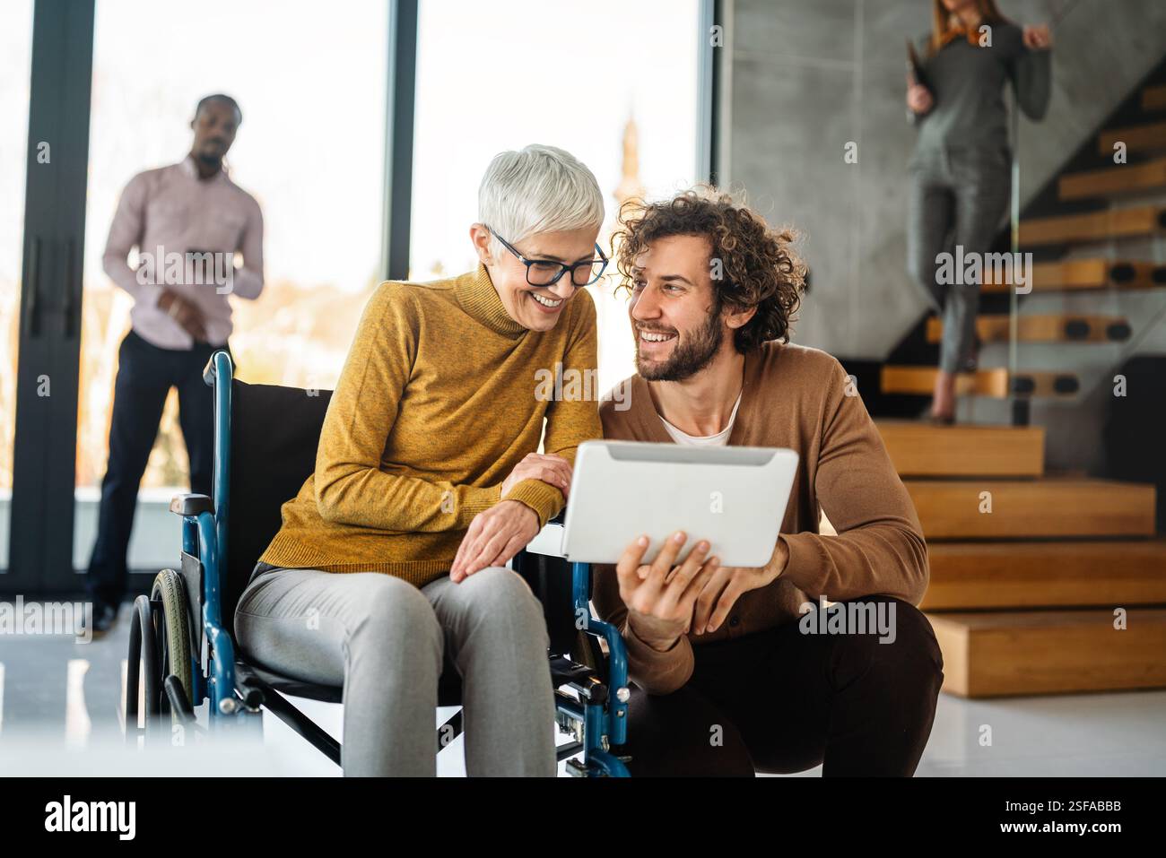 Multiracial coworkers analyzing charts and working together showing ...