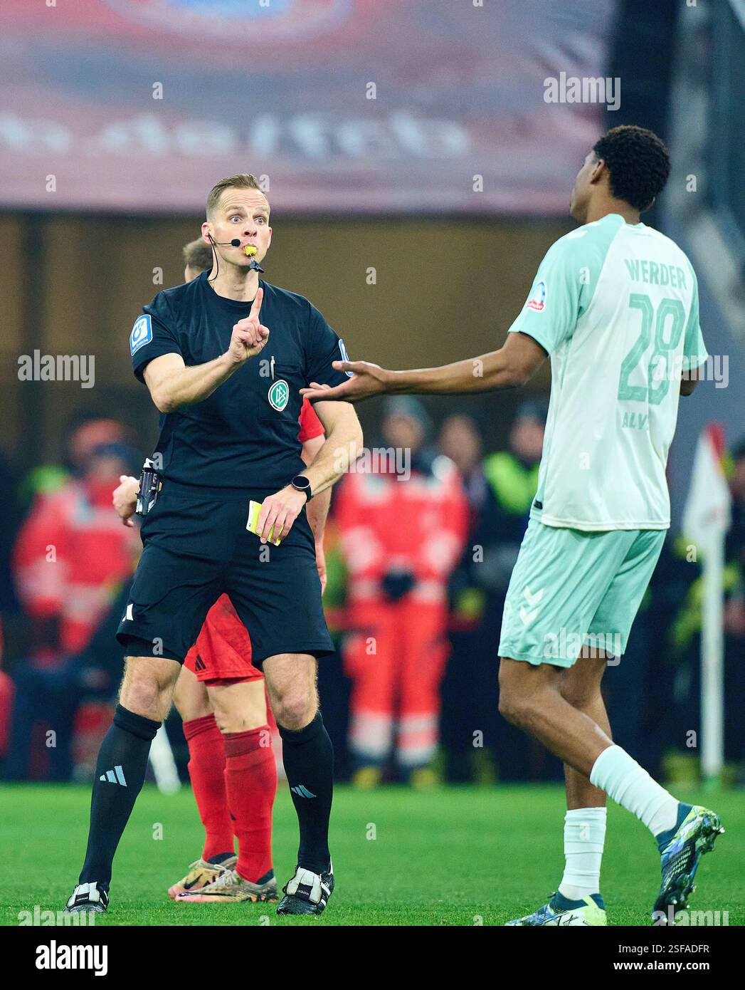 referee Soeren Storks with whistle, gestures, shows, watch, individual ...