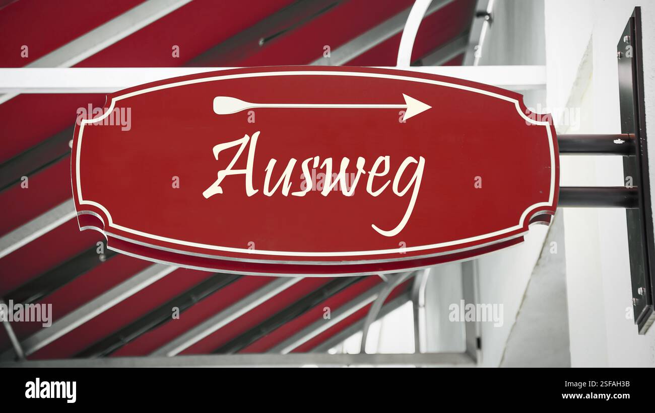 Image shows a signpost and a sign in the direction of exit in German ...
