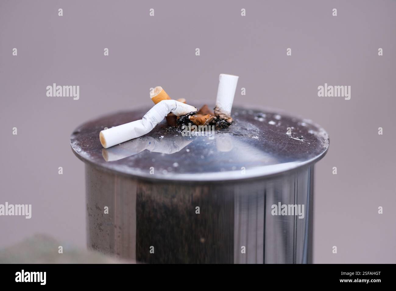 Cigarettes in an ash tray Stock Photo - Alamy