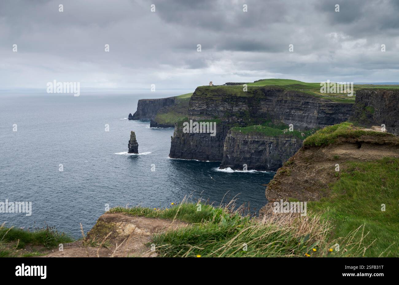 The Cliffs of Moher on Ireland’s west coast, with an overcast sky ...