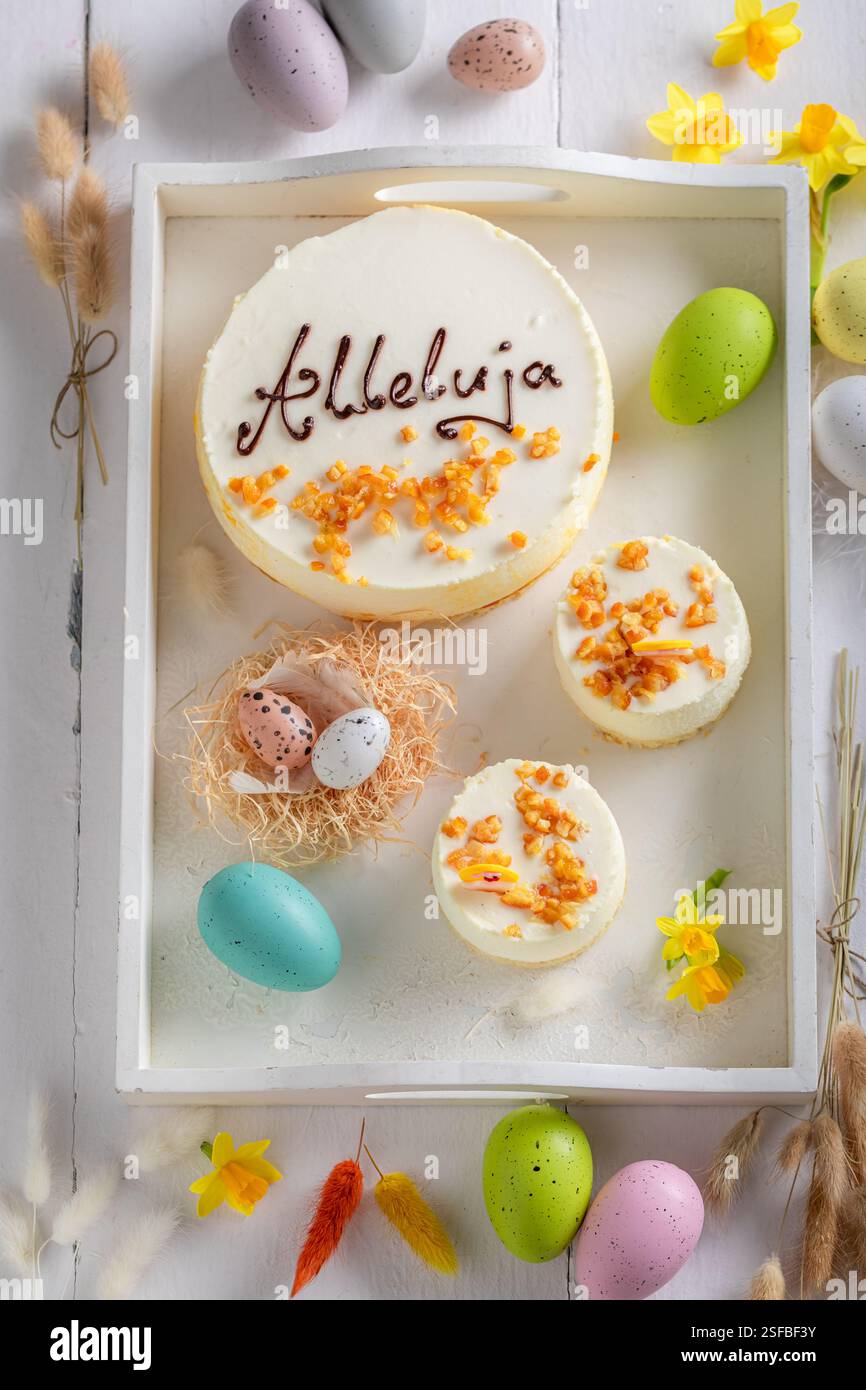 Traditional Easter curd pudding surrounded by spring flowers and eggs ...