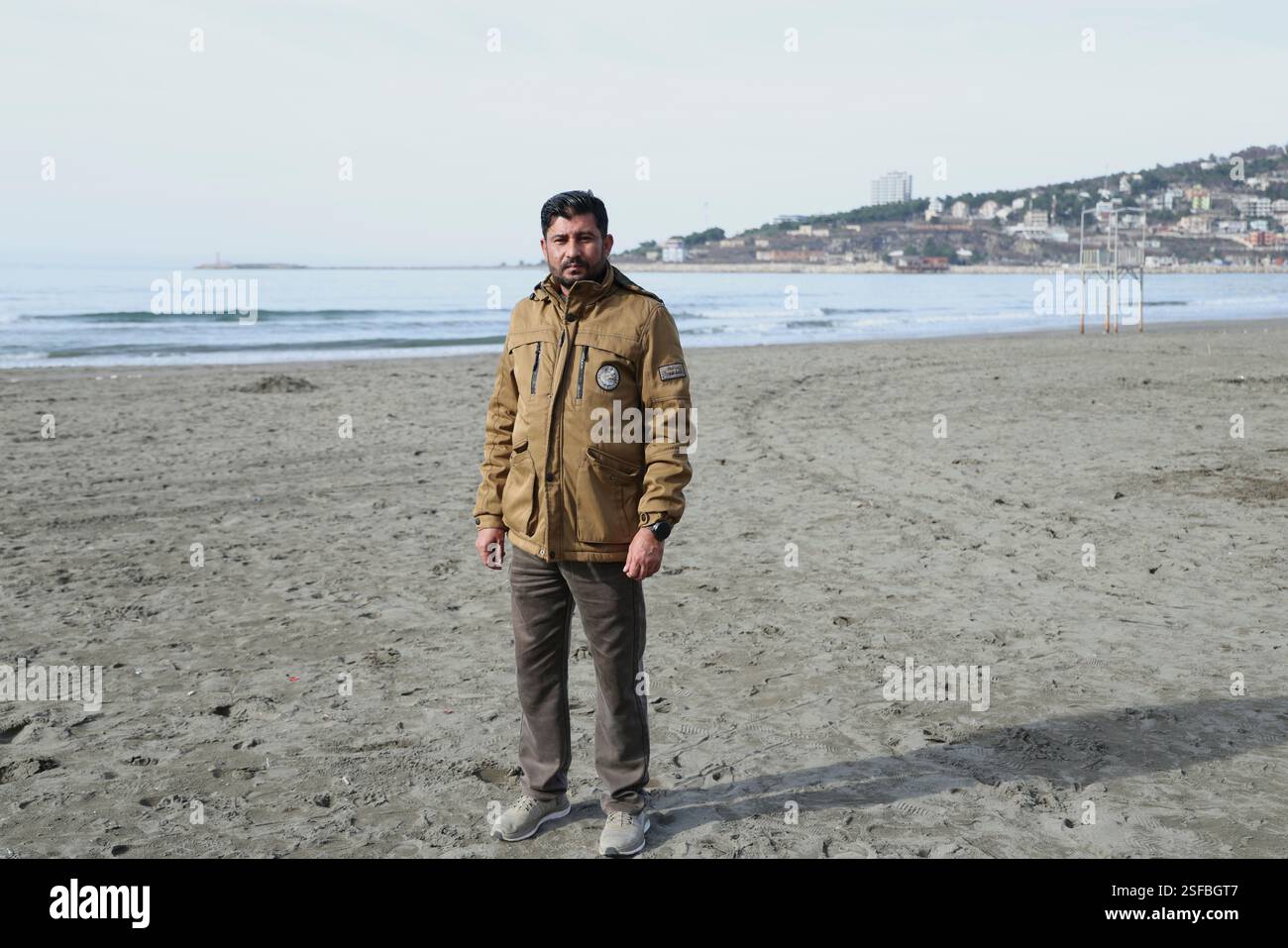 Afghan Hashmatullah Alam, 40, who worked with U.S. Army, poses at a ...