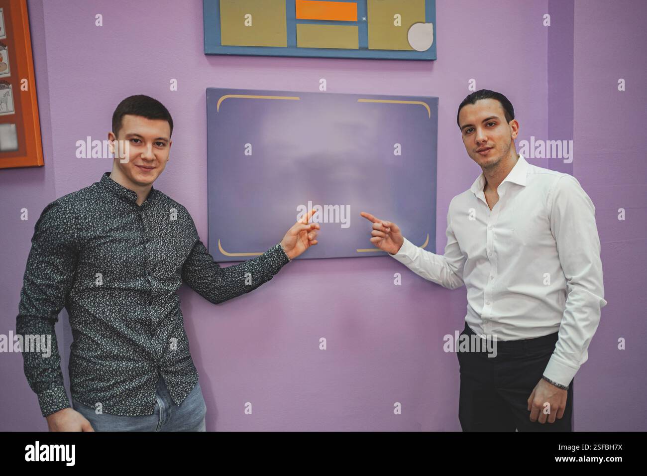 Two male student in classroom Stock Photo - Alamy