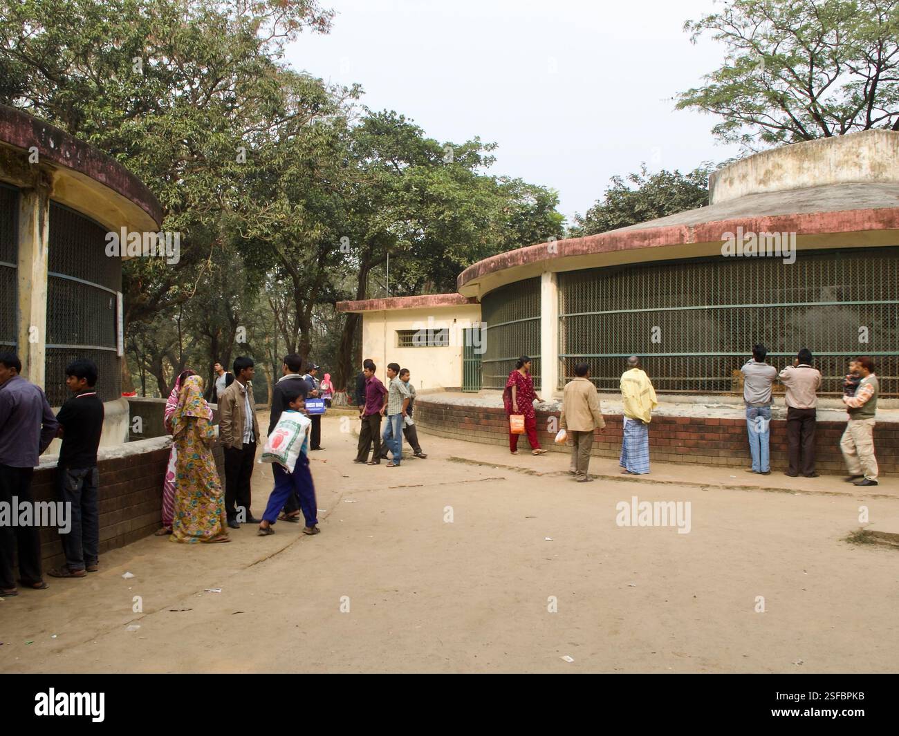 Visitors observe enclosures at Dhaka Zoo, Bangladesh, amidst worn ...