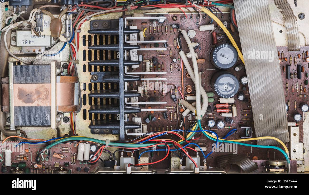 A photo of the circuit board of an old vintage integrated stereo ...