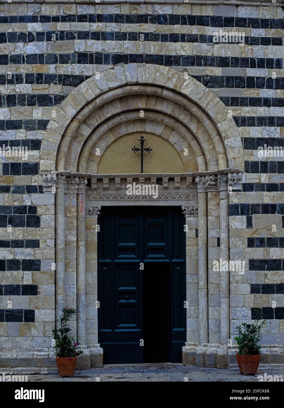 Romanesque main portal in coursed marble facade of Baptistery of San ...