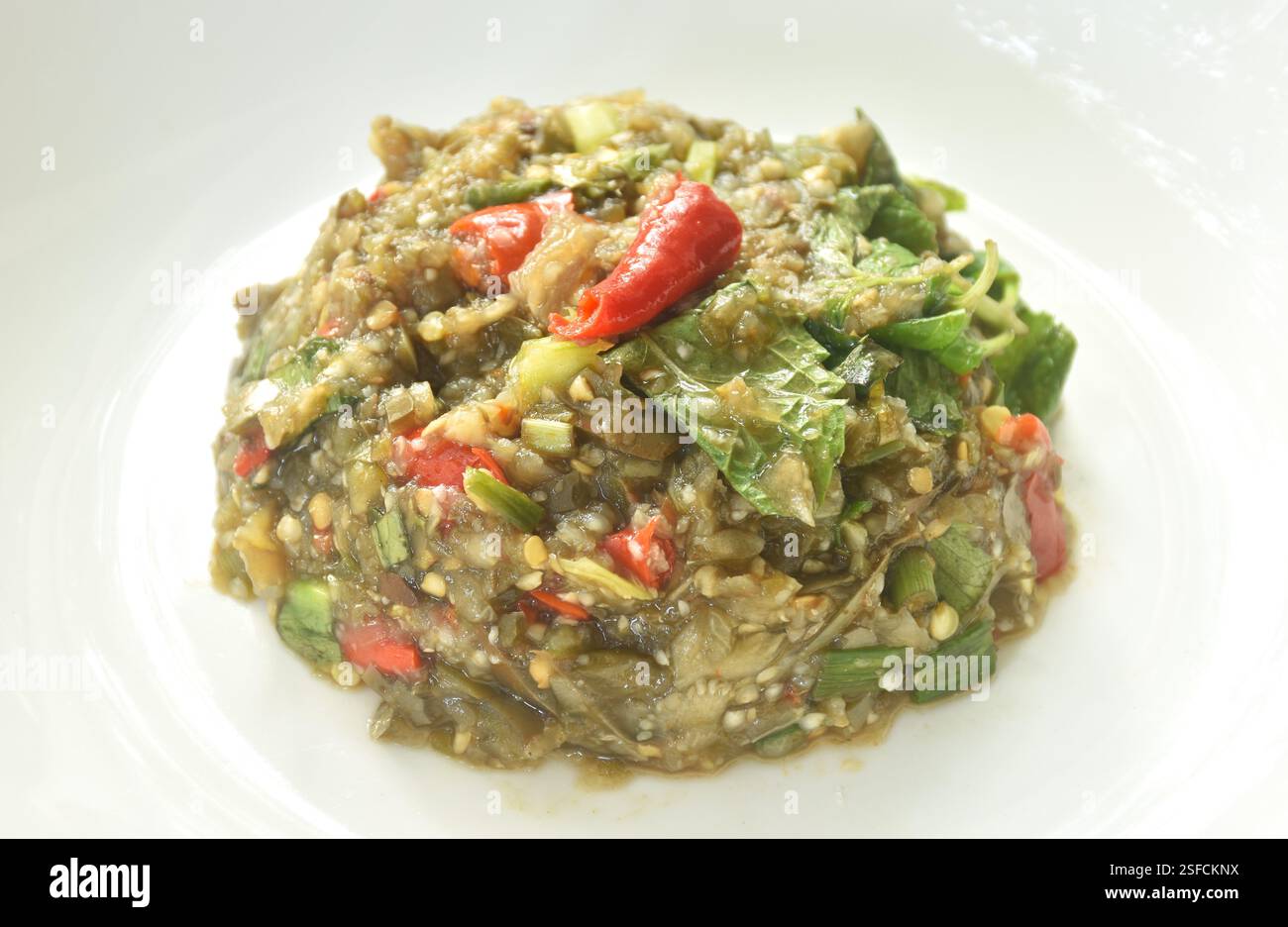 mashed spicy and sour eggplant salad Thai eastern style food on plate ...