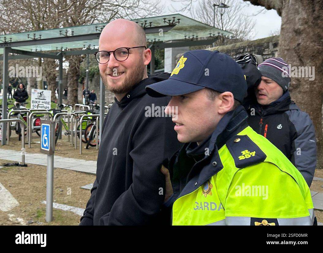 Stephane Benz (left) leaves the Criminal Courts of Justice in Dublin ...