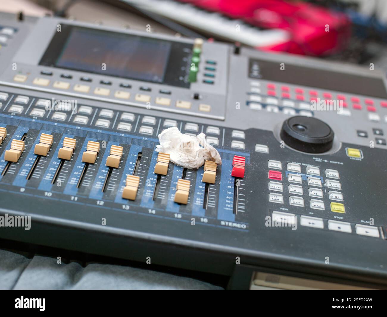 cleaning faders of studio mixing console with tissue, indoor shot Stock ...