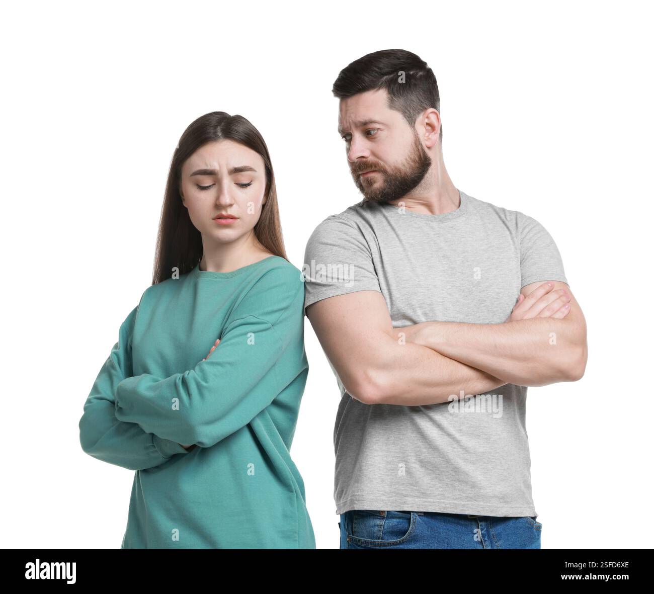 Resentful couple with crossed arms on white background Stock Photo - Alamy