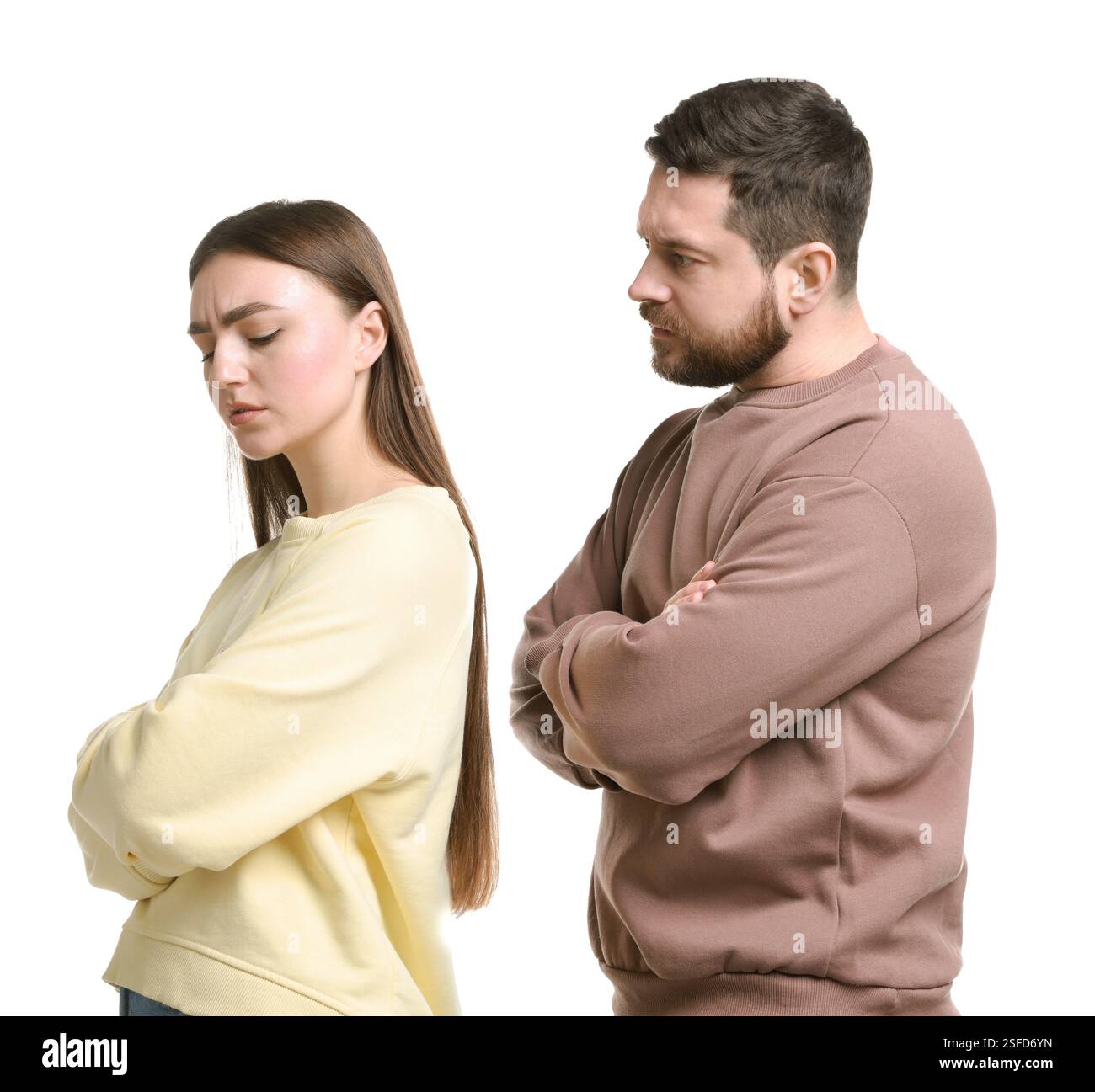 Resentful couple with crossed arms on white background Stock Photo - Alamy