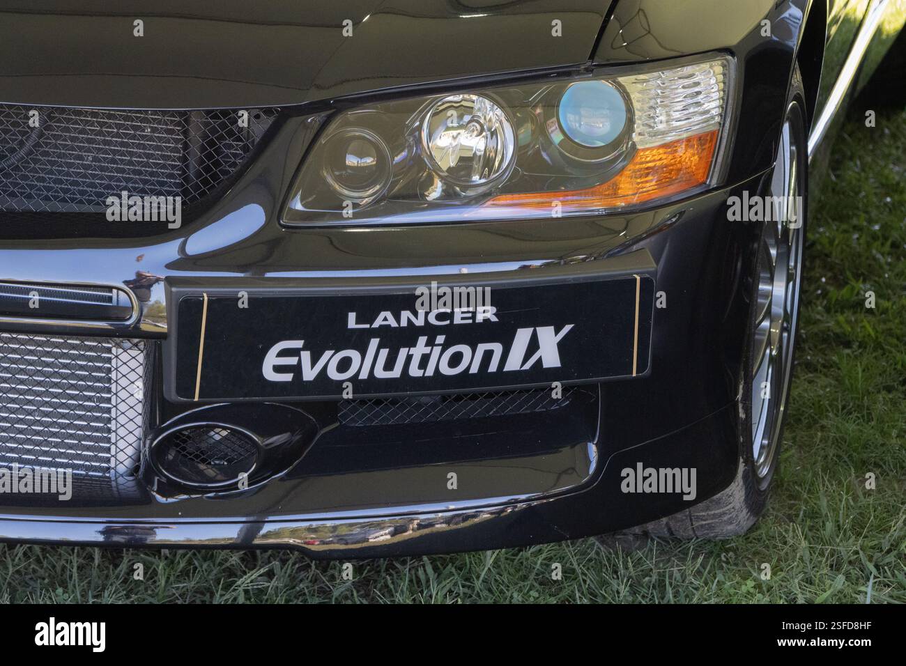 Detailed view of the front end of a black mitsubishi lancer evolution ...