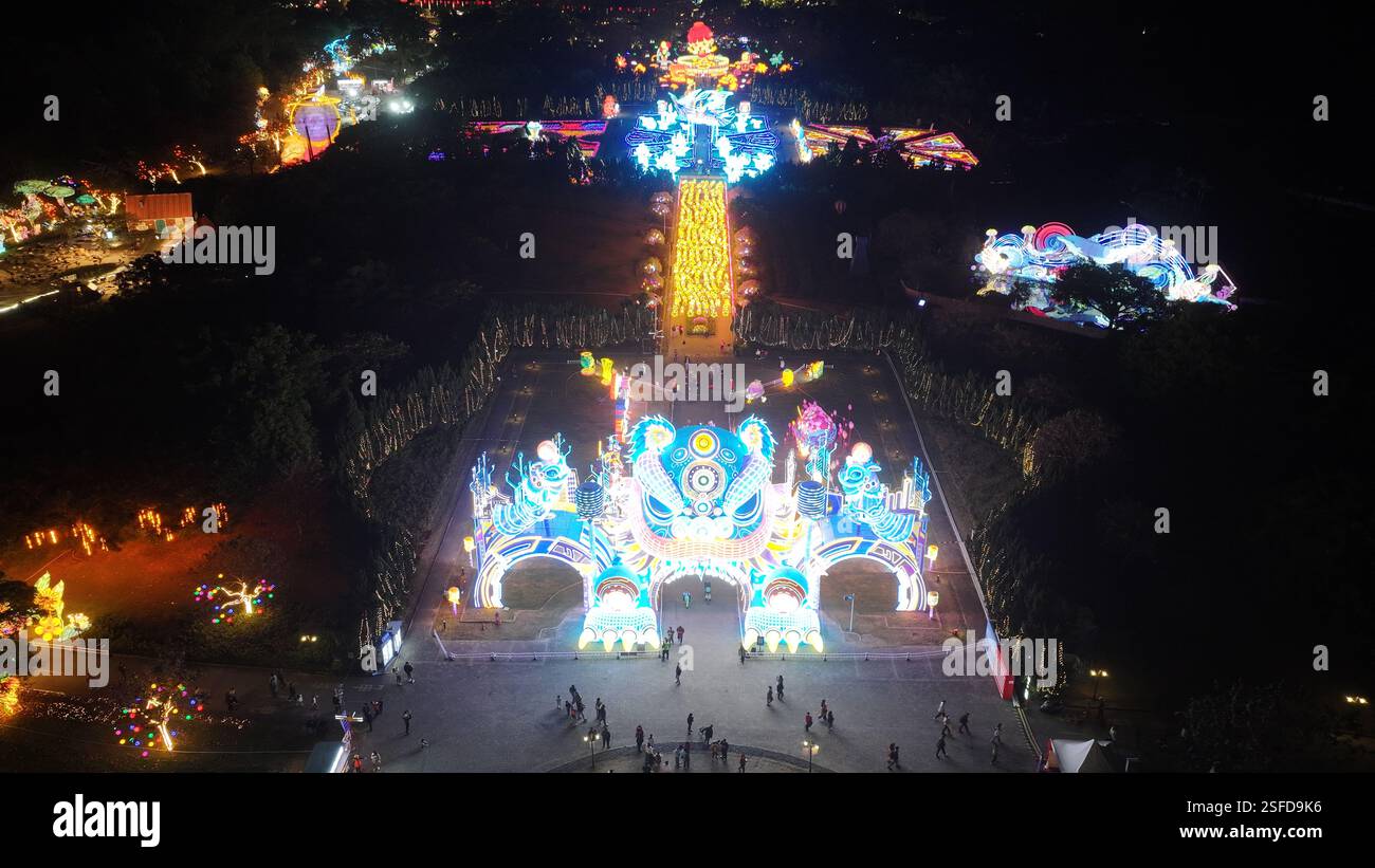 GUANGZHOU, CHINA - FEBRUARY 5, 2025 - Tourists view festive lanterns at ...