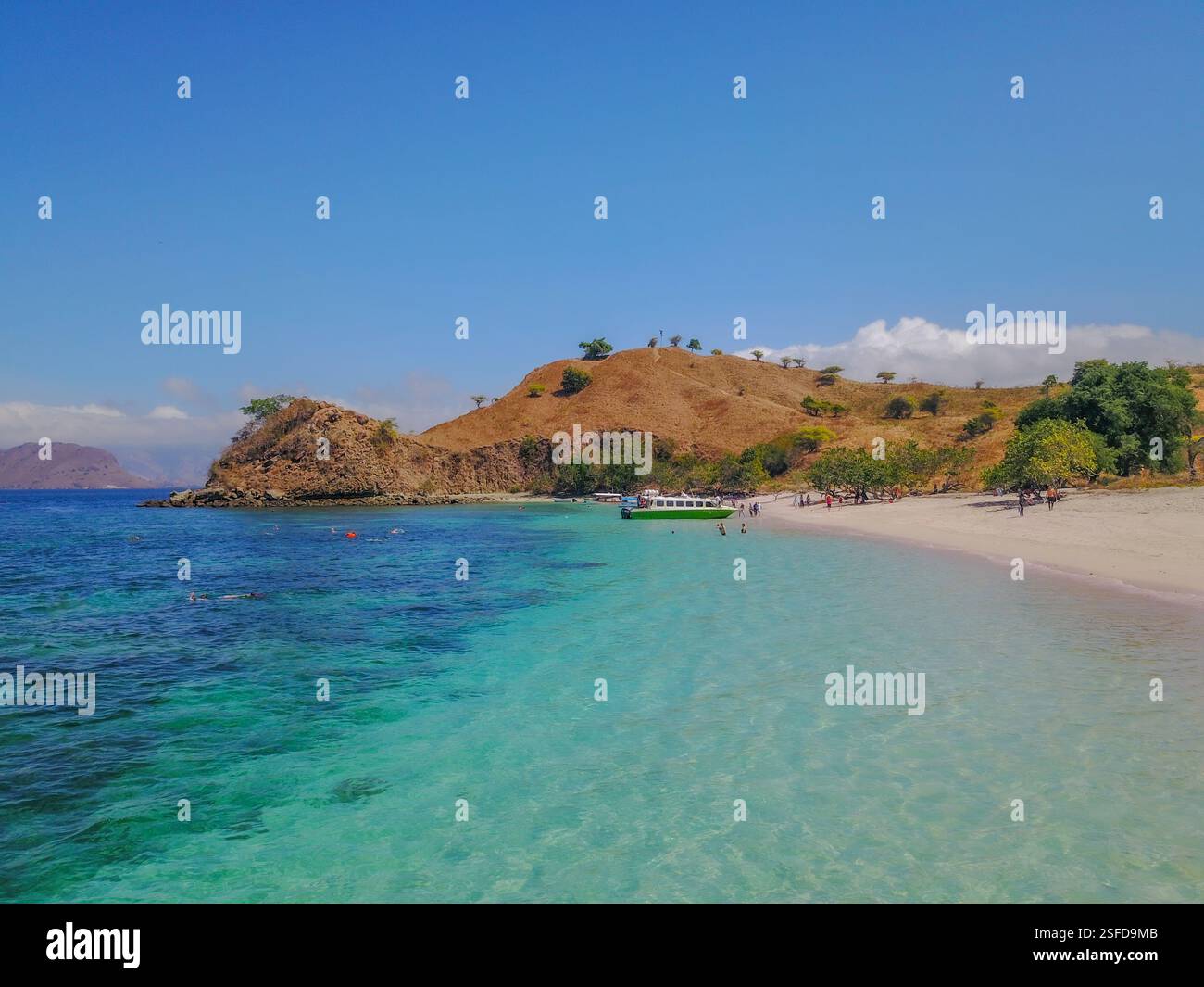 Distant group of people on Pink Beach (Pantai Merah), Komodo, Komodo ...