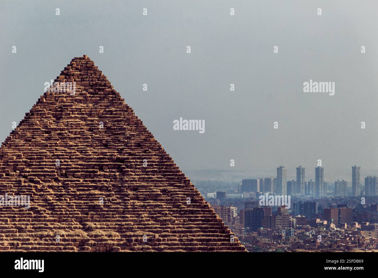 Close-up high section of a pyramid with the city skyline in the ...