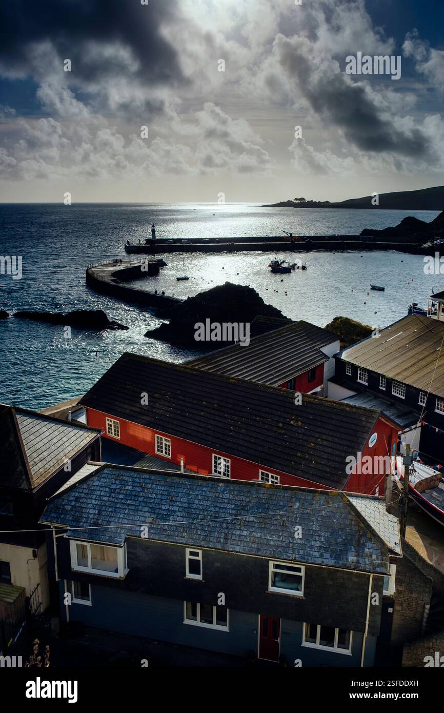 Mevagissey harbour showing old fishermens houses and Chapel Point ...