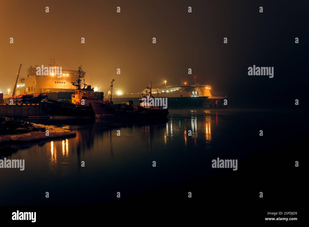 Ships moored at the port of Klaipeda at night, Lithuania Stock Photo ...