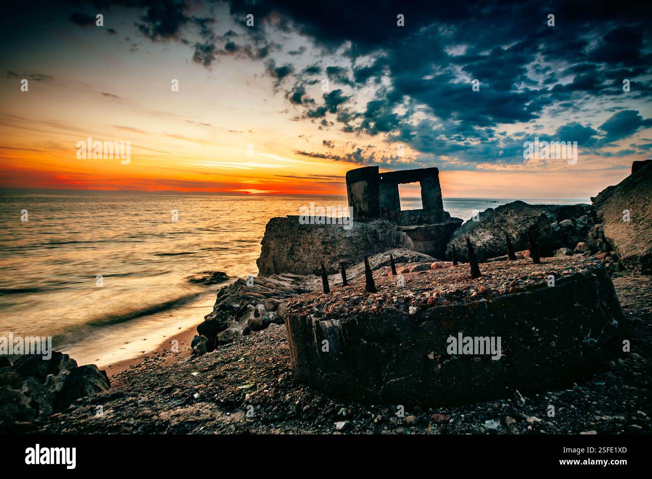 Concrete fortifications on beach at sunset, Karosta, Liepaja, Latvia ...