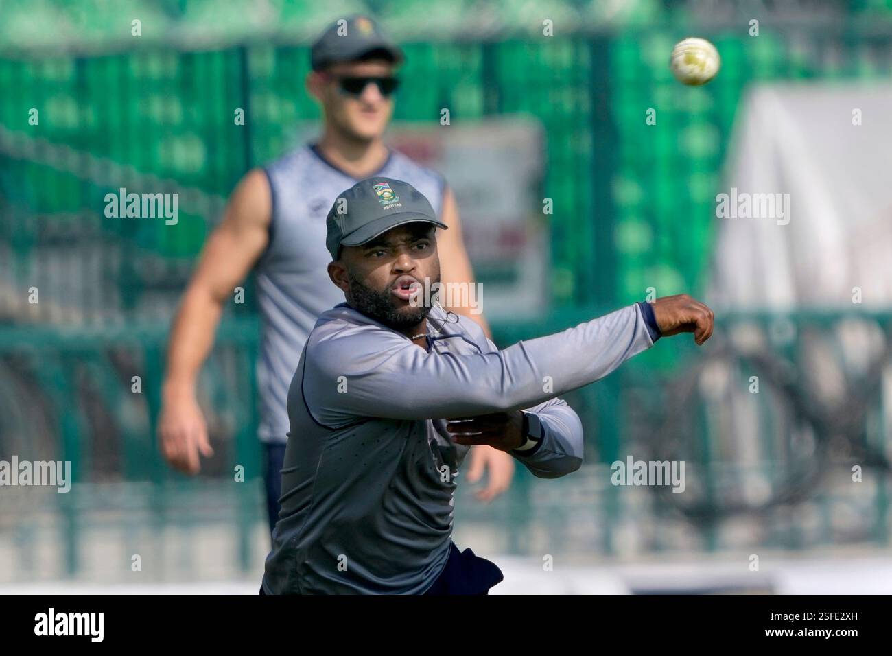 South Africa's skipper Temba Bavuma, front, throws the ball during a ...