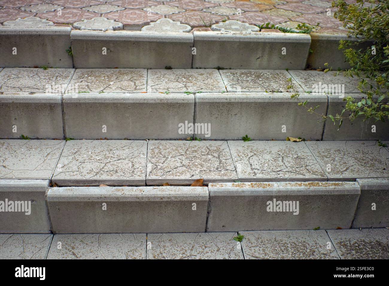 damaged tiled steps of outdoor staircase, daylight shot, no people ...