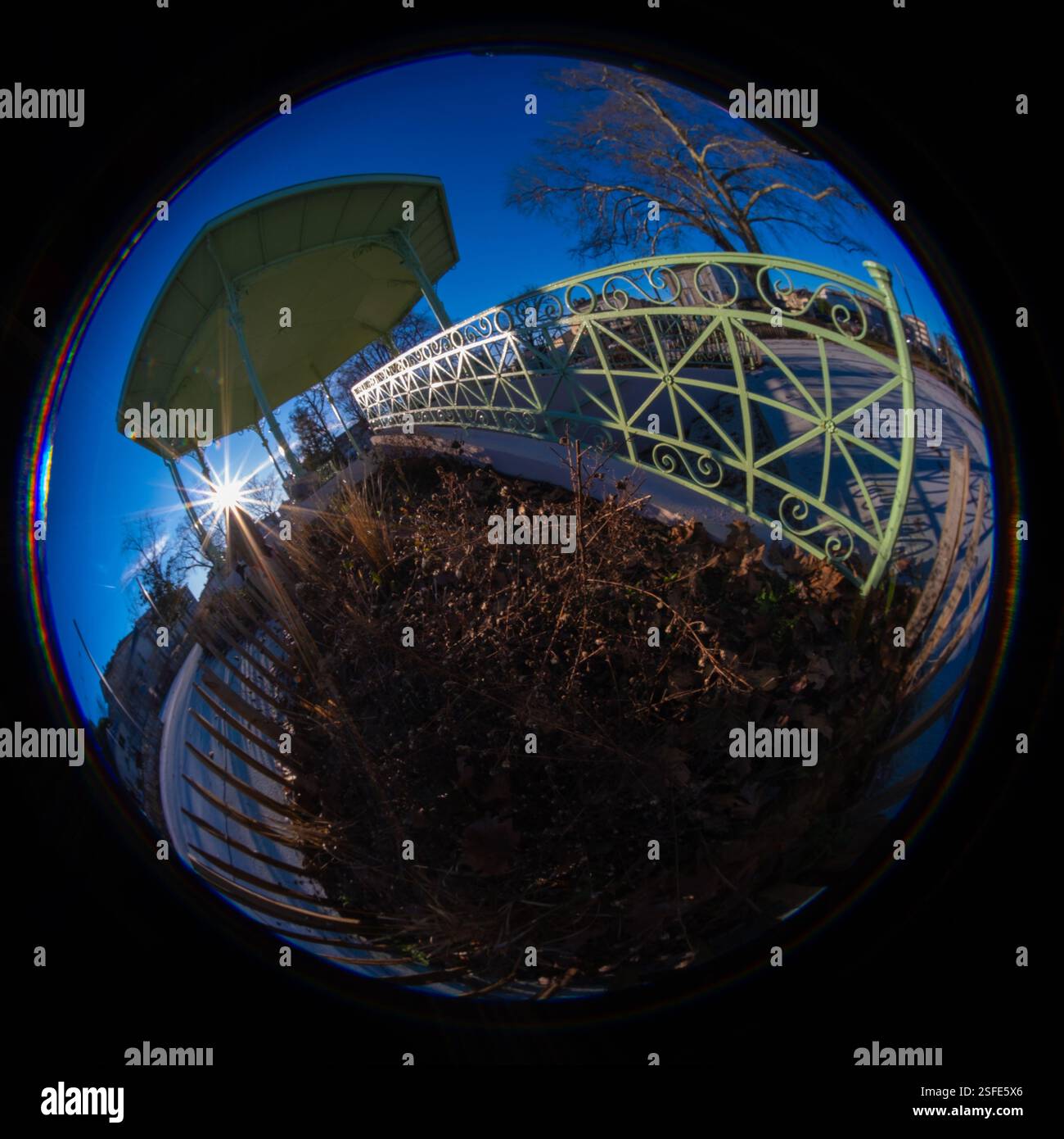 circular fisheye view of a green music kiosk rooftop seen from under ...