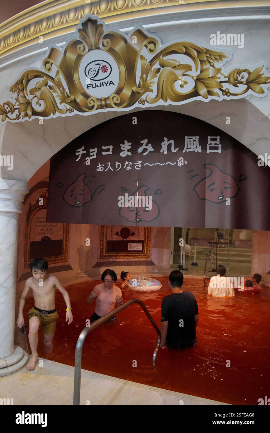 Hakone, Japan. 09th Feb, 2025. Bathers enjoy in a chocolate bath at the ...