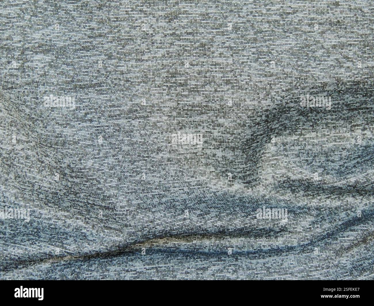 grey variegated fabric with wavy crumpled surface as drapery background ...