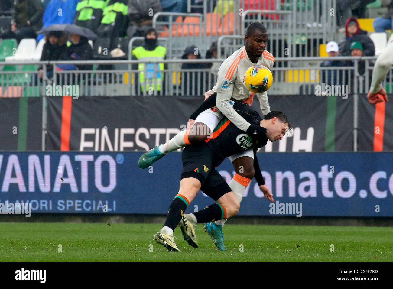 Venezia, Italia. 09th Feb, 2025. Roma's Evan Ndicka and Venezia's ...