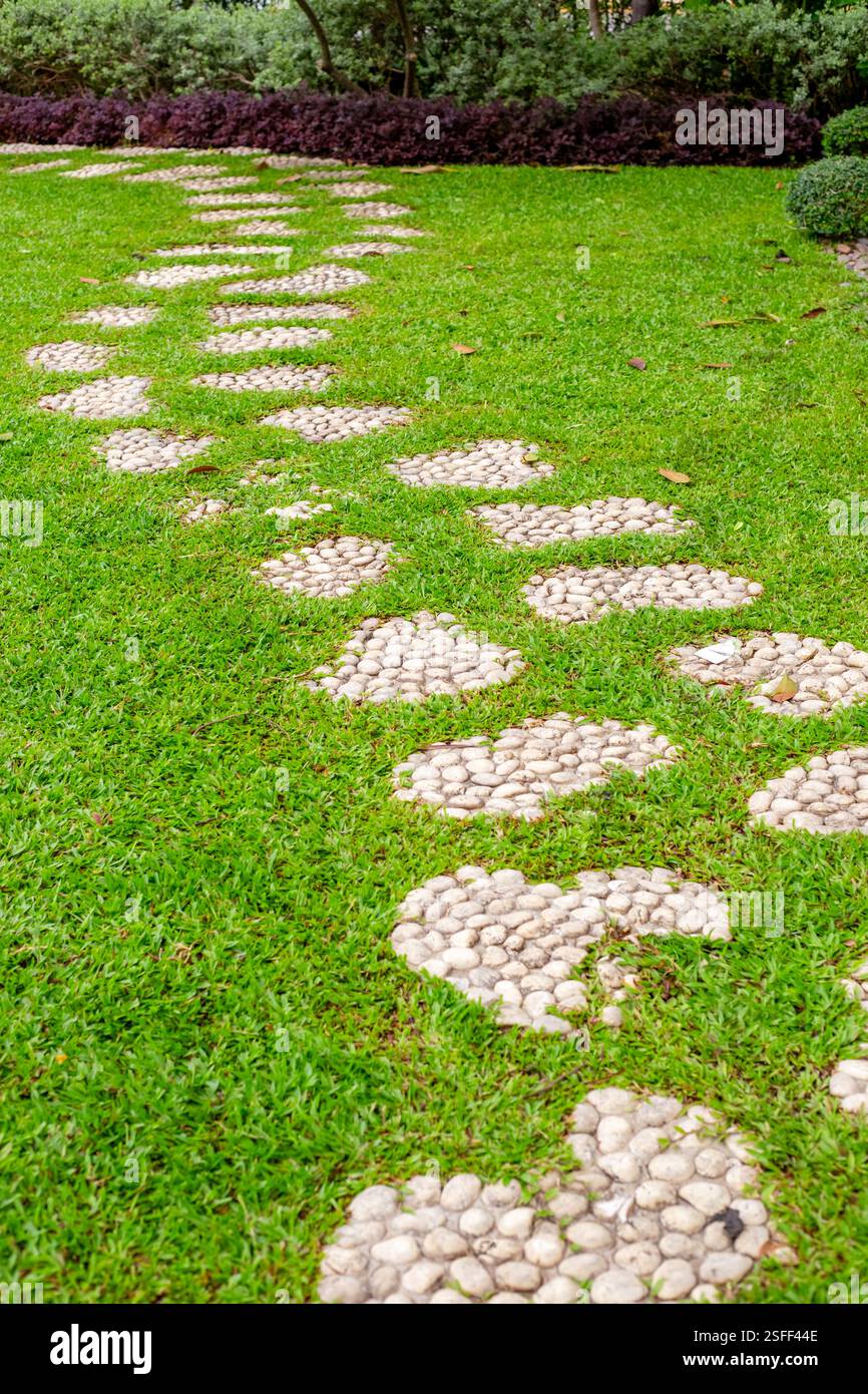 Landscape design of the city park. Path of stones on a green lawn Stock ...