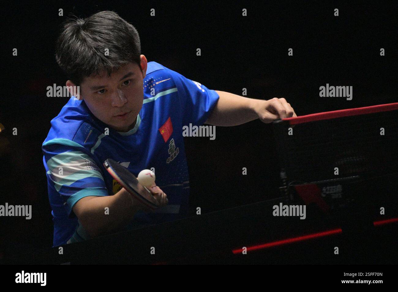 Singapore. 9th Feb, 2025. Lin Shidong hits a return during the men's ...