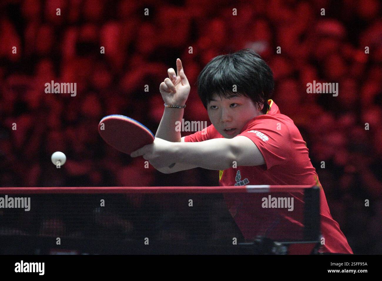 Singapore. 9th Feb, 2025. Kuai Man hits a return during the women's ...