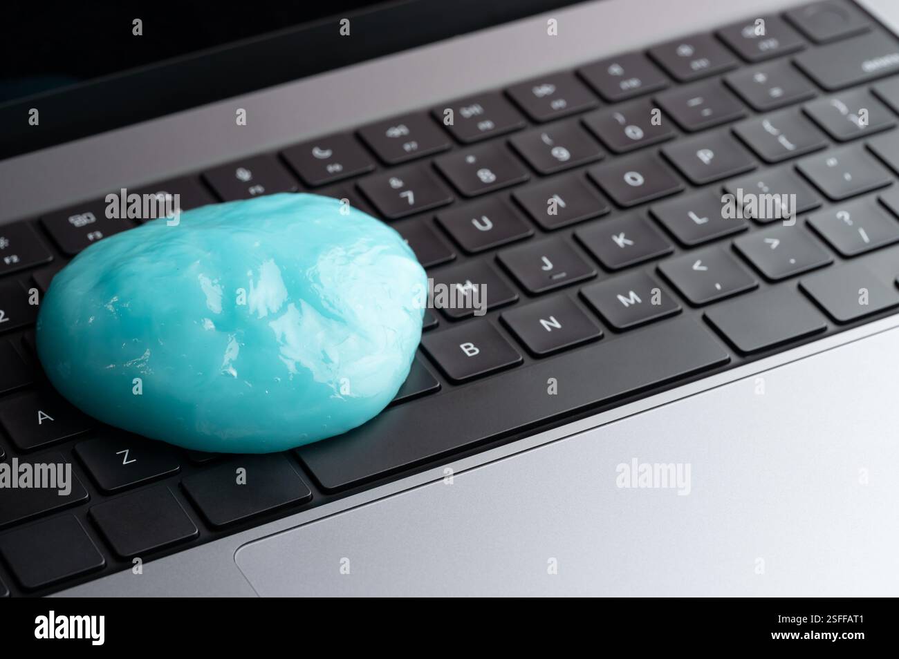 Clean computer keyboard theme. Blue gel on black keyboard Stock Photo ...