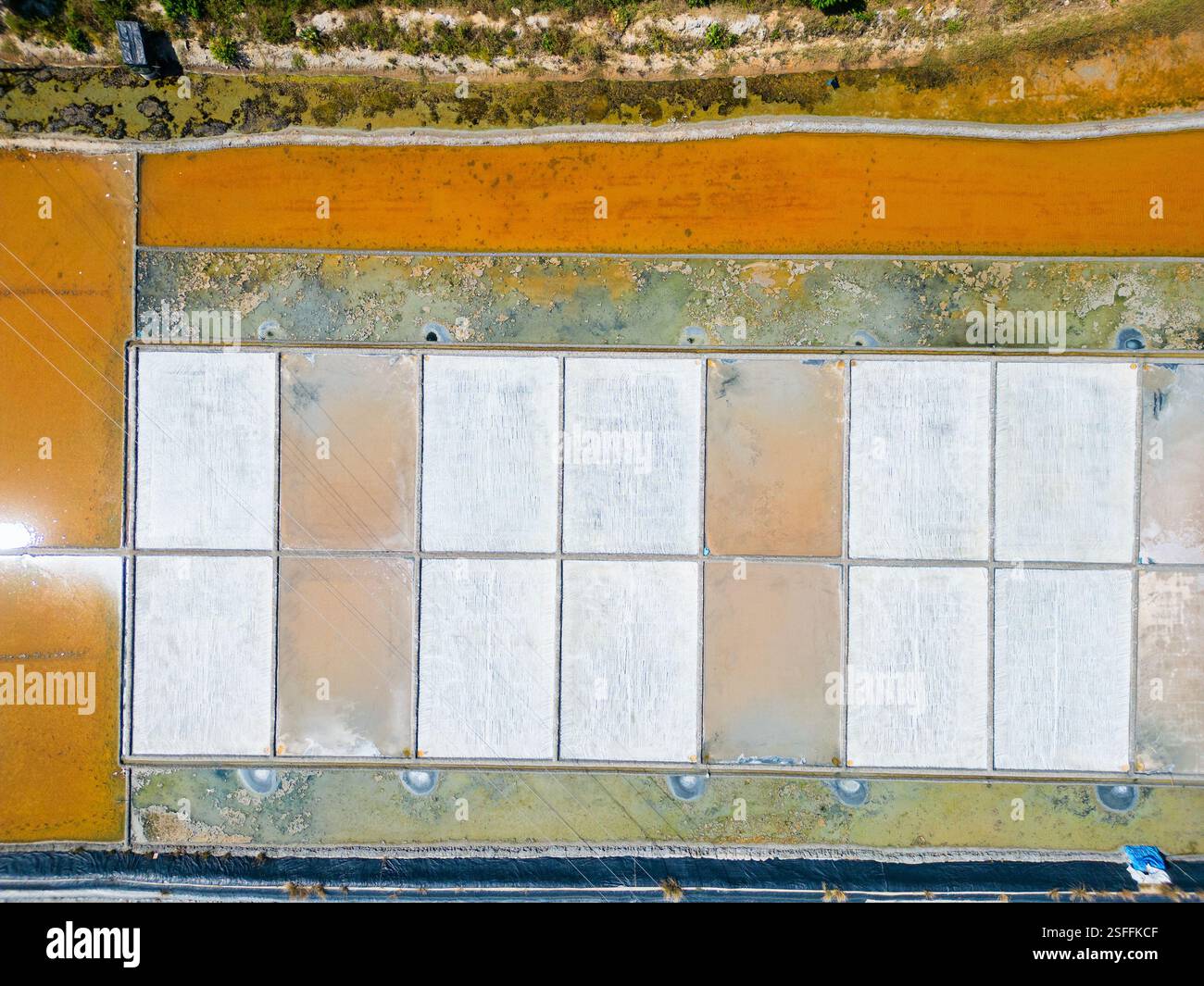 Aerial view of large rectangular salt pans used for salt production ...