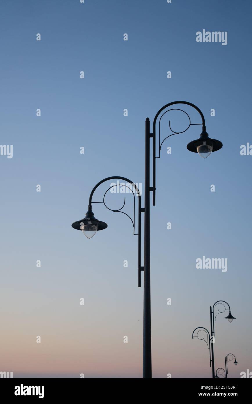 Public street lighting pole with LED lights with sunset color ...