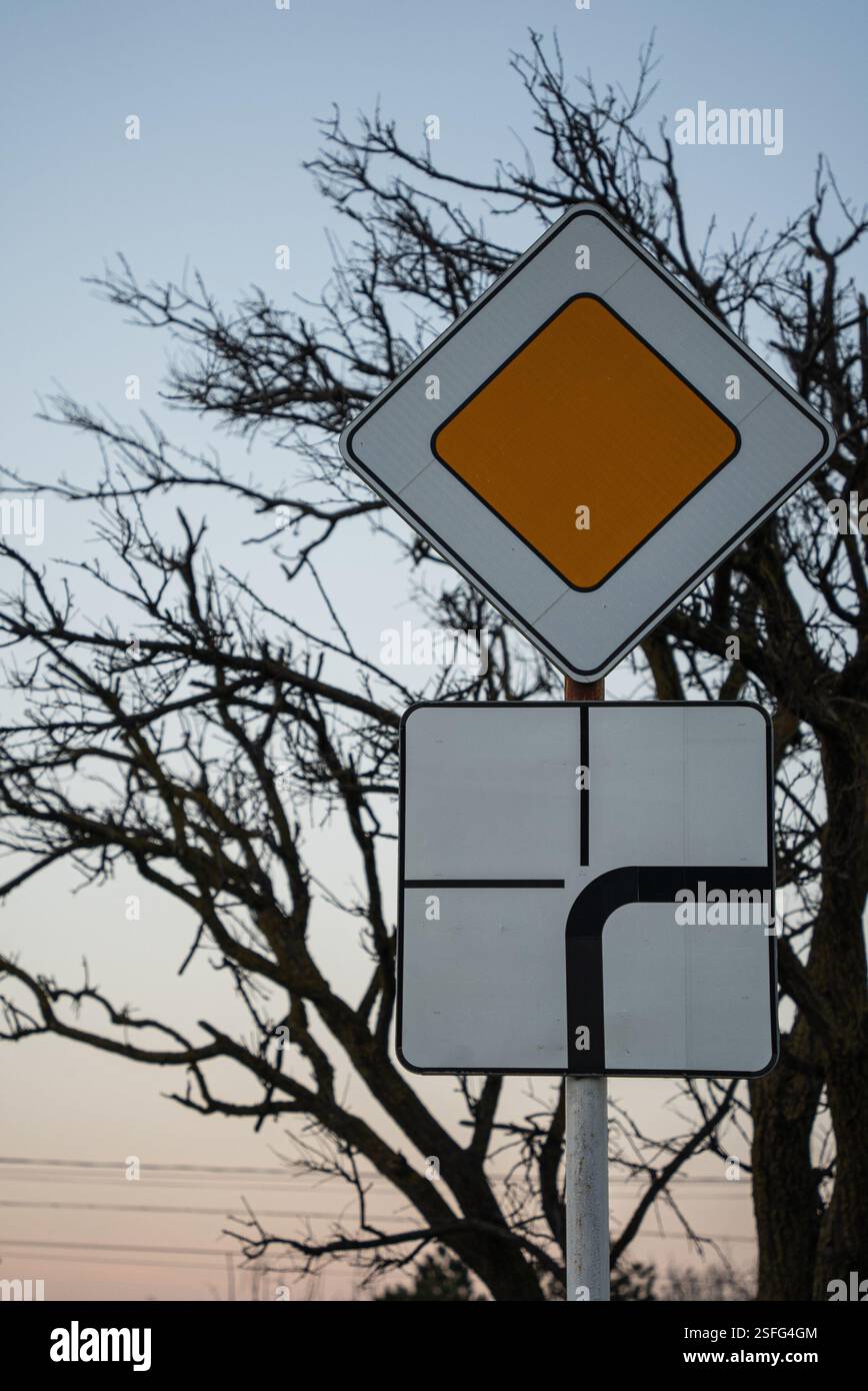 road sign the main road changes direction Stock Photo - Alamy