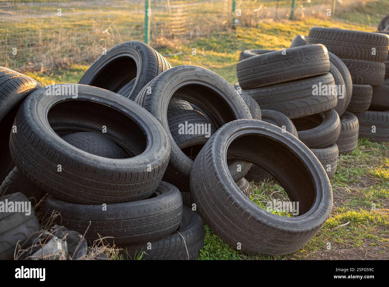 rubber recycling car tire old wheels waste stack Stock Photo - Alamy