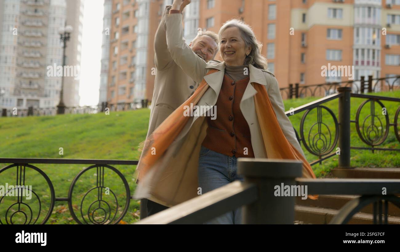 Caucasian mature middle-aged woman man married couple dance together ...