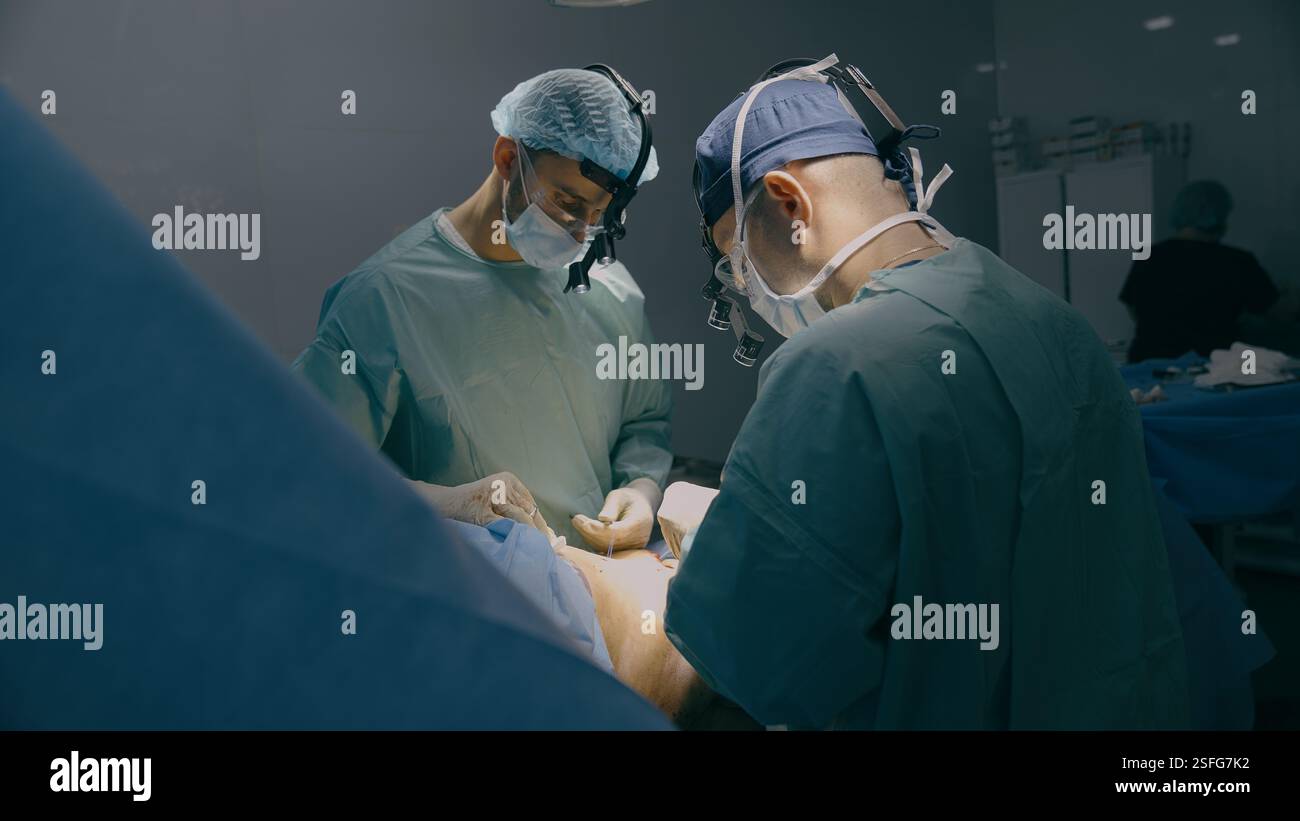 Medical team men doctors surgeons medics processing bariatric surgery ...