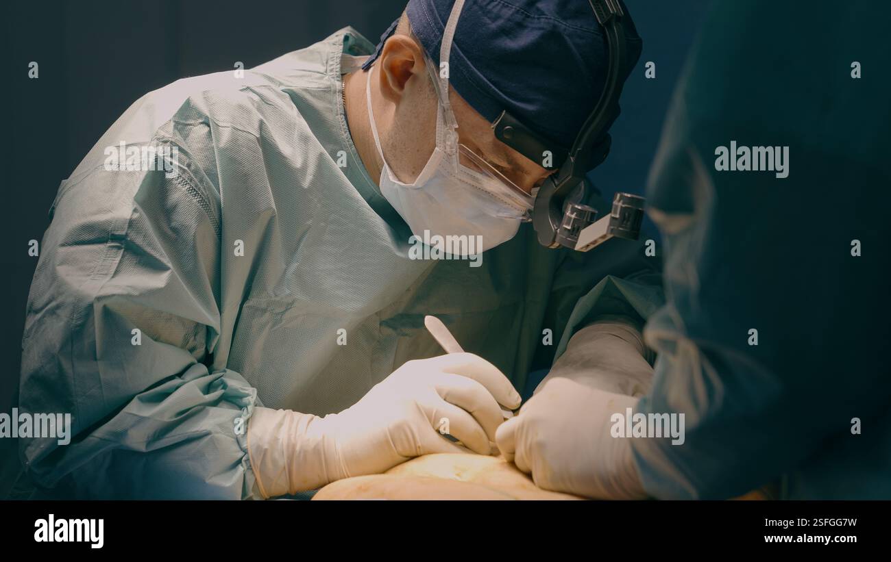 Two doctors operating patient in clinic hospital surgeon man medic ...