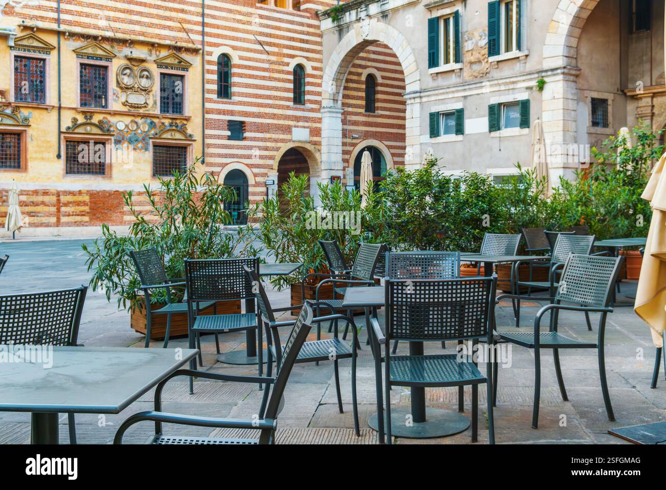 Outdoor summer cafe tables and chairs outside in old town square Piazza ...