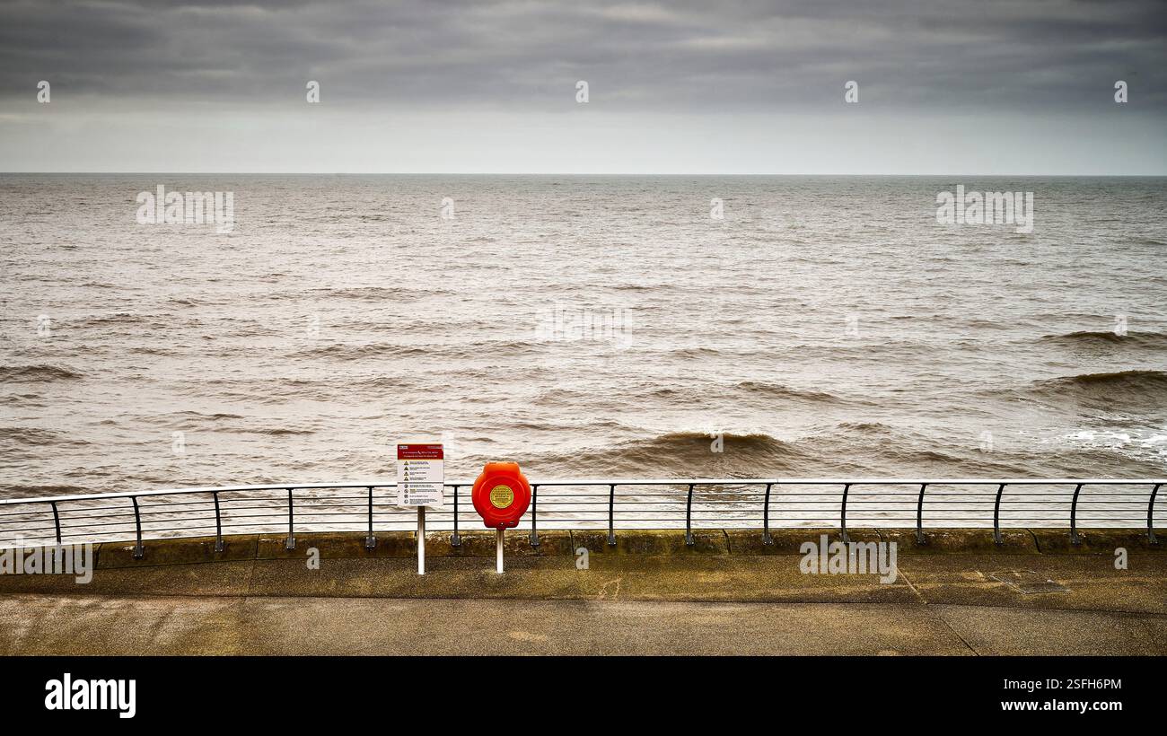 Life belt and water safety information board on an empty Blackpool ...