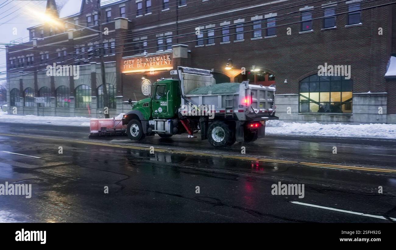 NORWALK, CT, USA - FEBRUARY 9, 2025: A snow plow truck is actively ...