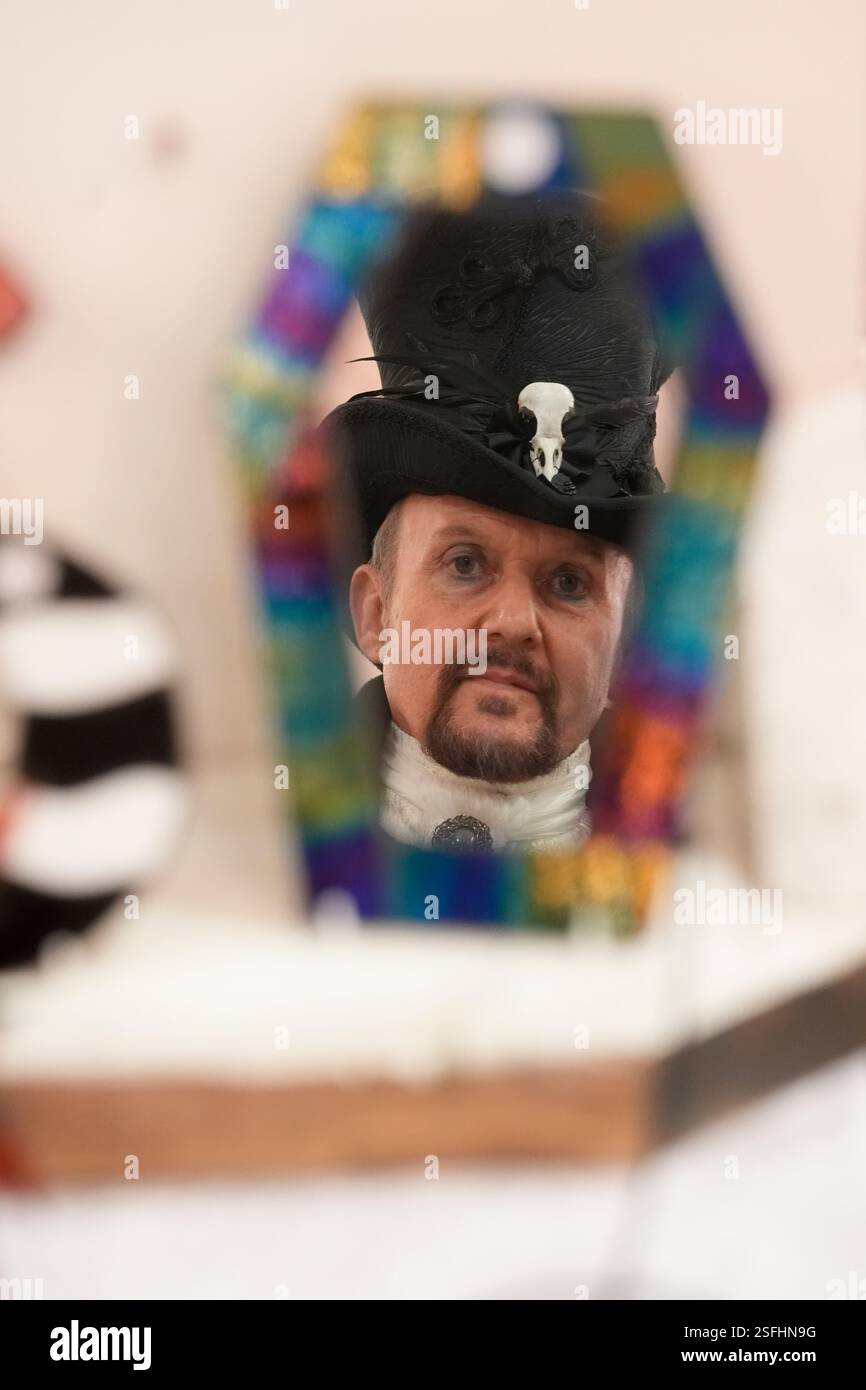 Steampunk Dave Stephenson looks at his reflection in a coffin shaped ...