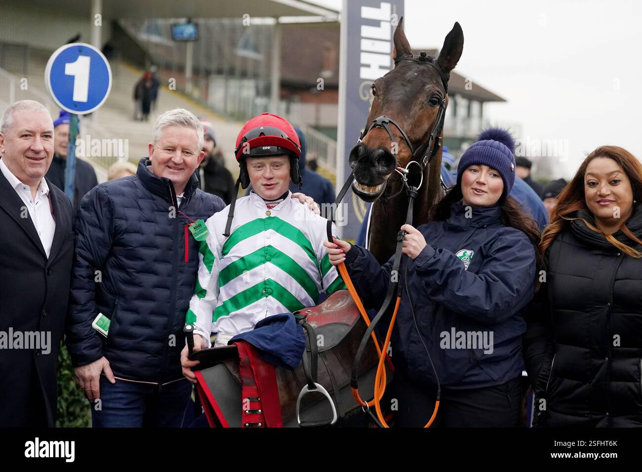 Better Days Ahead and jockey Sam Ewing (centre left) with their team ...